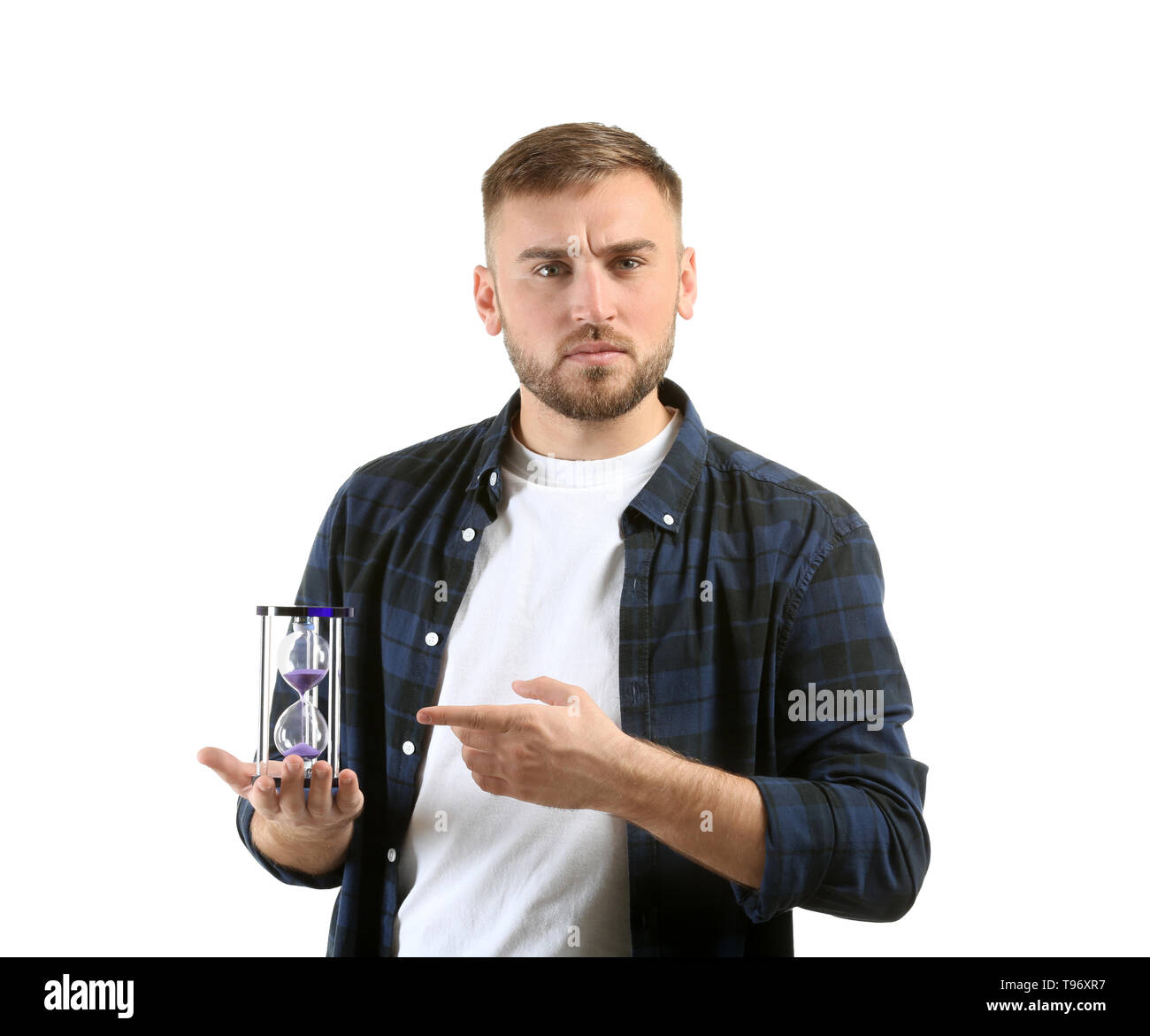 Grumpy man with hourglass on white background Stock Photo - Alamy