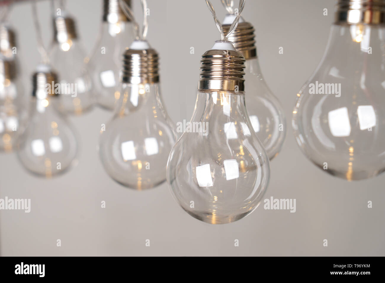 Light bulbs on grey background Stock Photo - Alamy