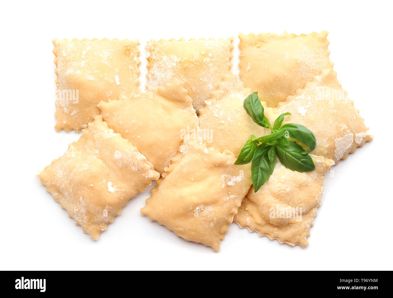 Uncooked ravioli on white background Stock Photo - Alamy