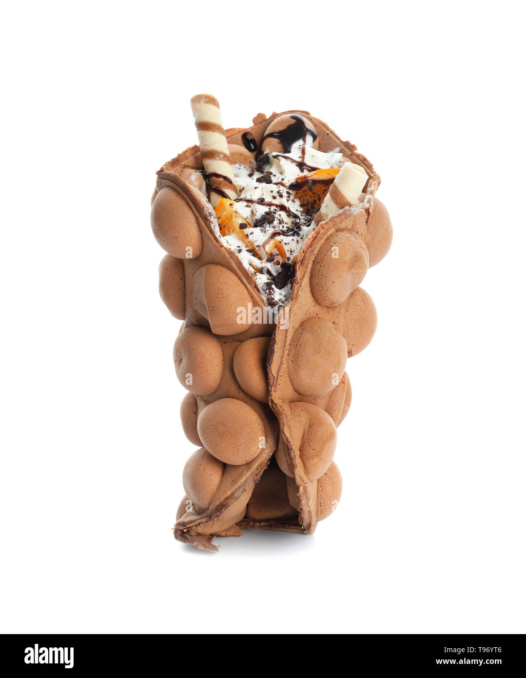Delicious sweet bubble waffle on white background Stock Photo - Alamy