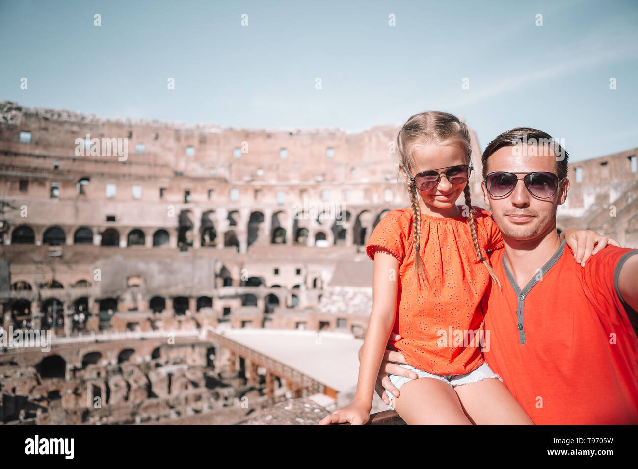Happy family in Rome over Coliseum background Stock Photo - Alamy