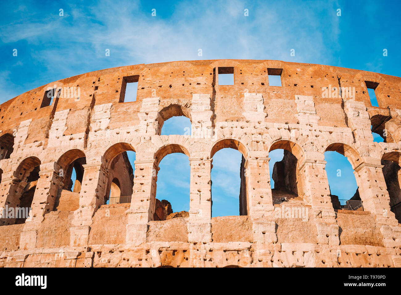 Colosseum or Coliseum background blue sky in Rome Stock Photo - Alamy