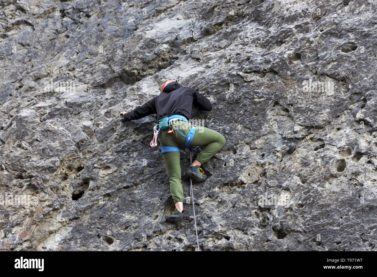 Athletic Male Climber Technical Climbing Vertical Rock Wall at Grassi ...