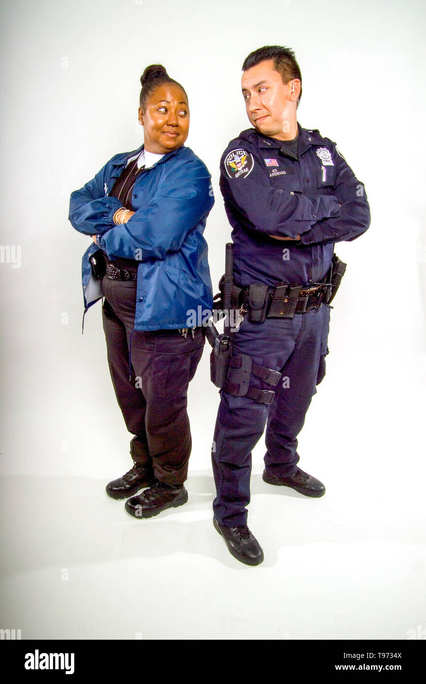 African American and Caucasian Amtrak railroad security police pose at ...