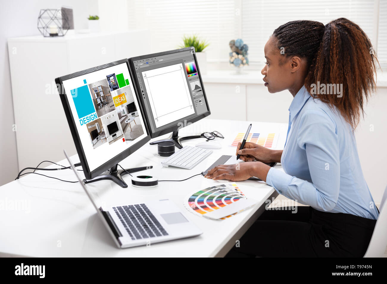 Female photographer editing photos on hi-res stock photography and ...