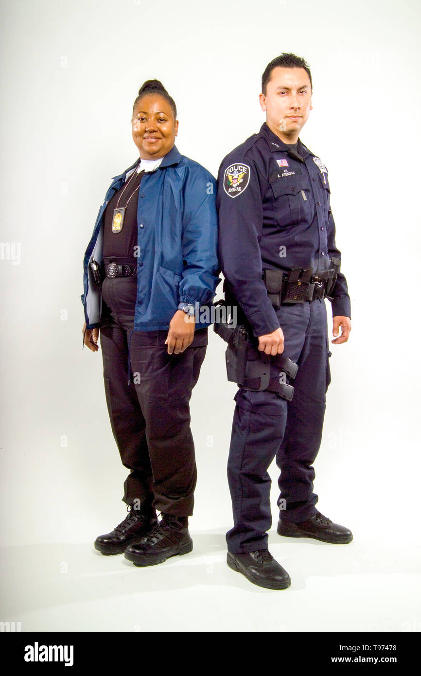African American and Caucasian Amtrak railroad security police pose at ...
