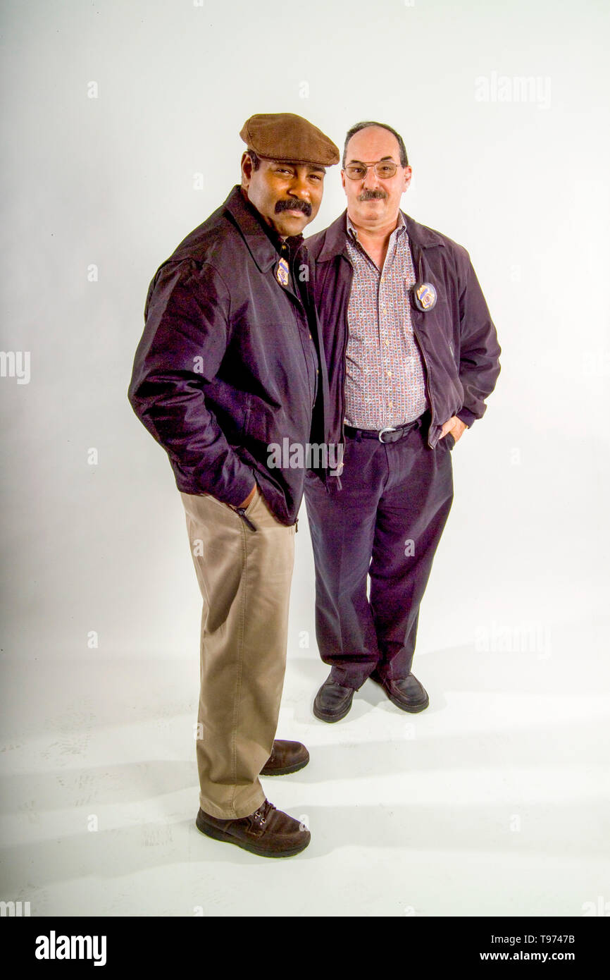 Identified only by their badges, two railroad security detectives pose ...