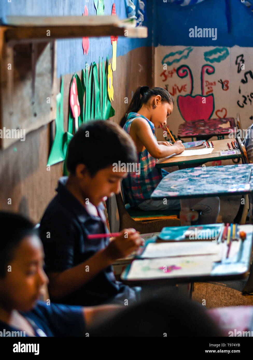 latin children writing in Guatemalan classroom Stock Photo - Alamy