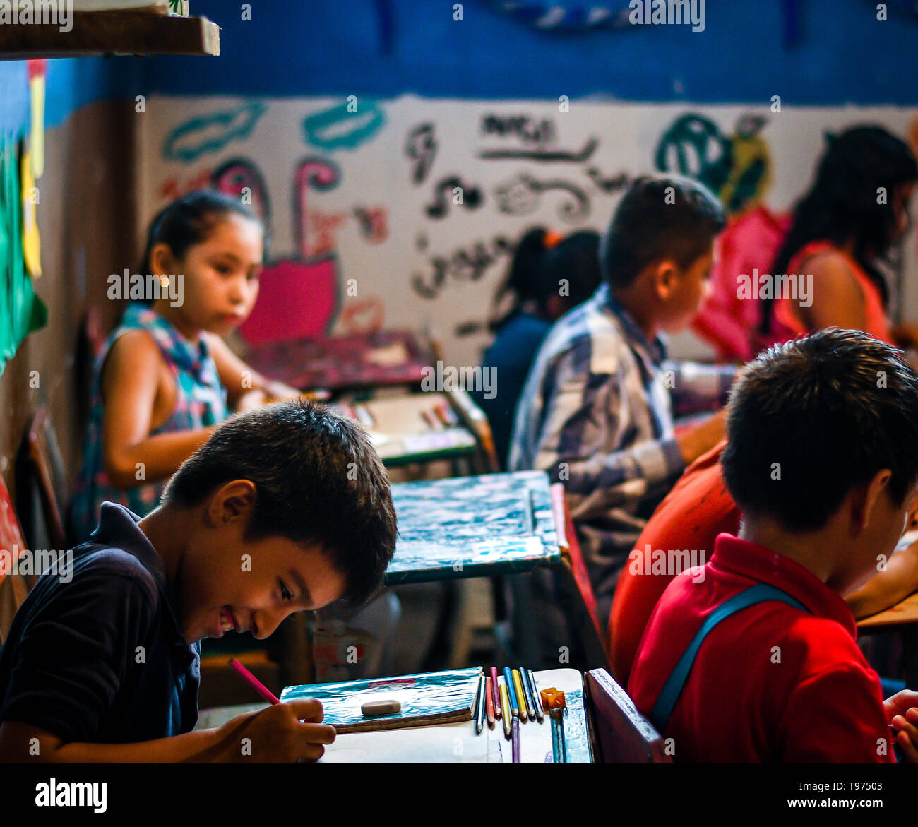 latin children writing in Guatemalan classroom Stock Photo - Alamy