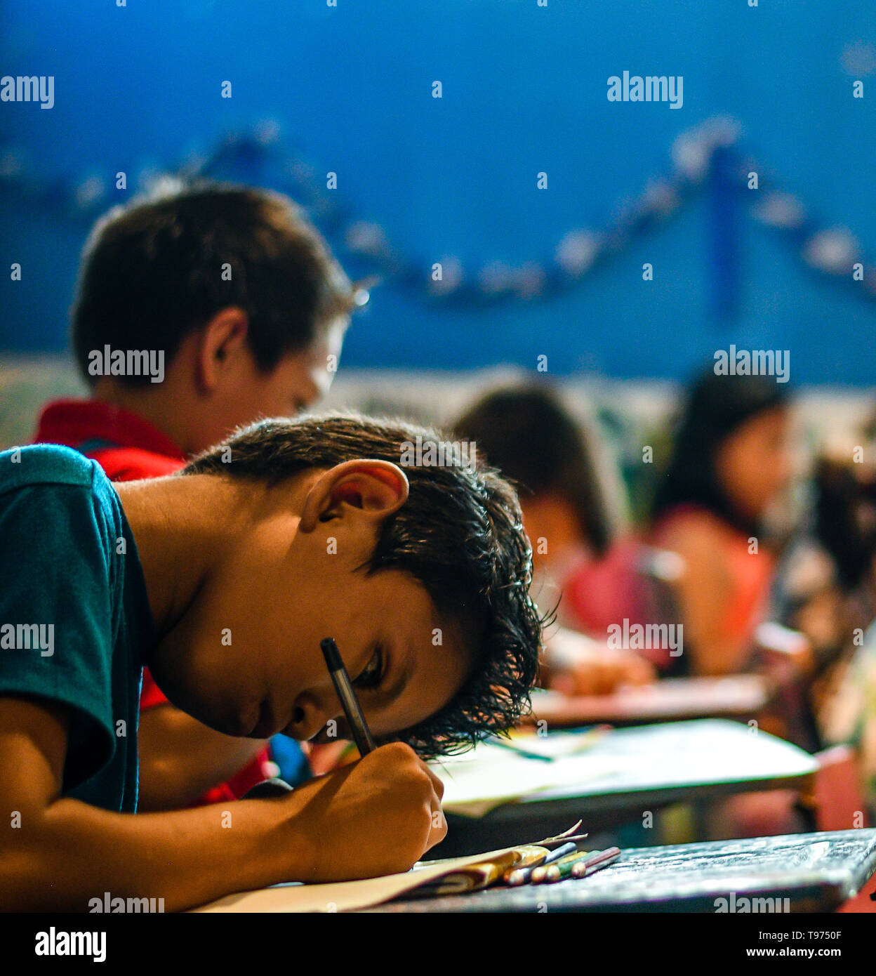 latin children writing in Guatemalan classroom Stock Photo - Alamy