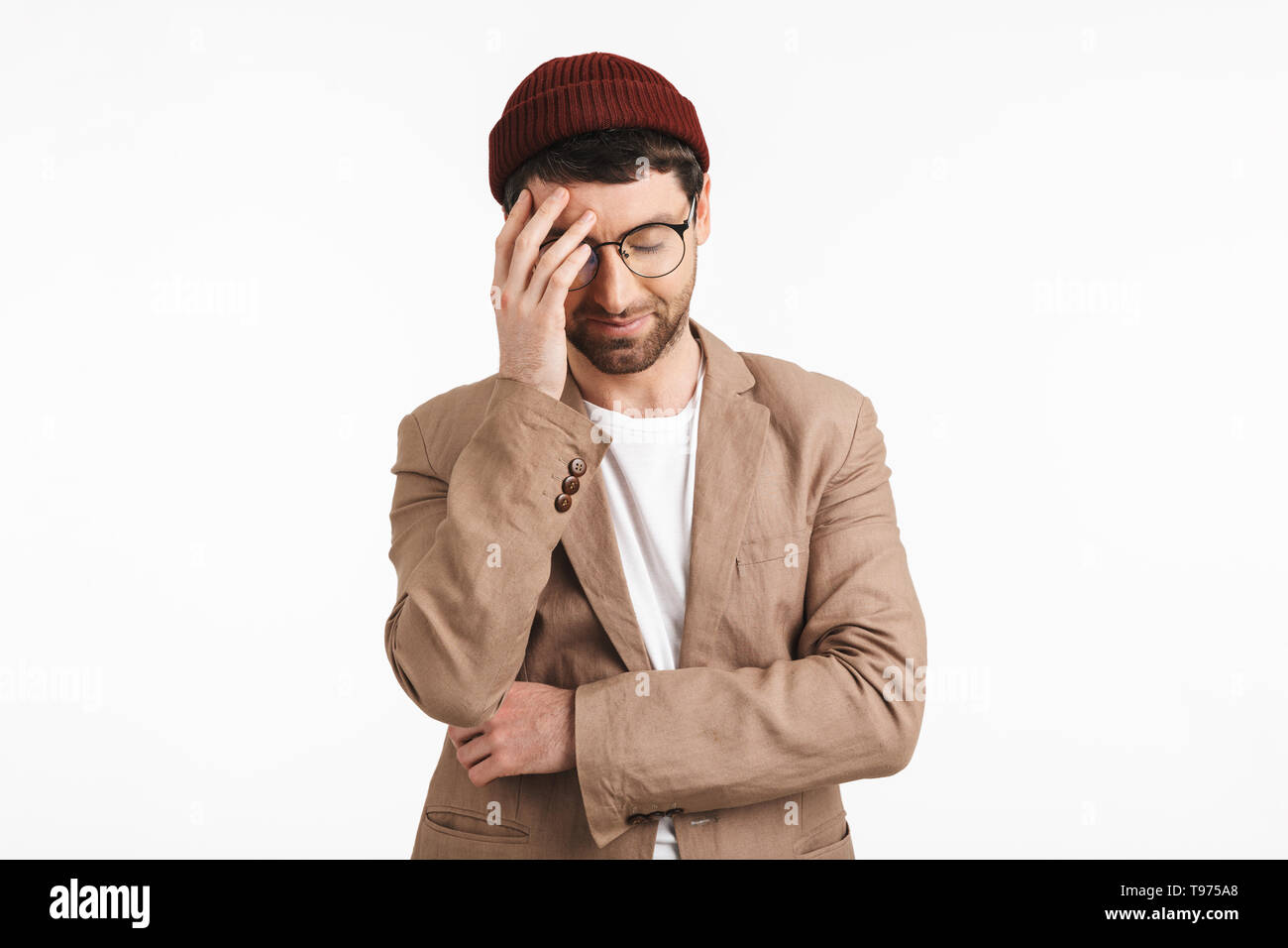 Photo of bearded man 30s wearing hipster hat smiling and touching his ...
