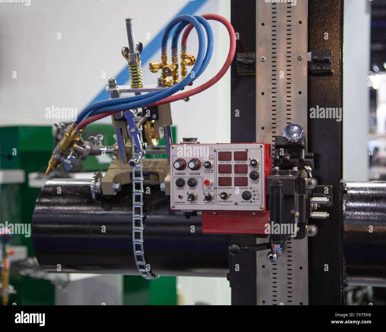Chain track pipe welding machine operate on big pipe Stock Photo - Alamy