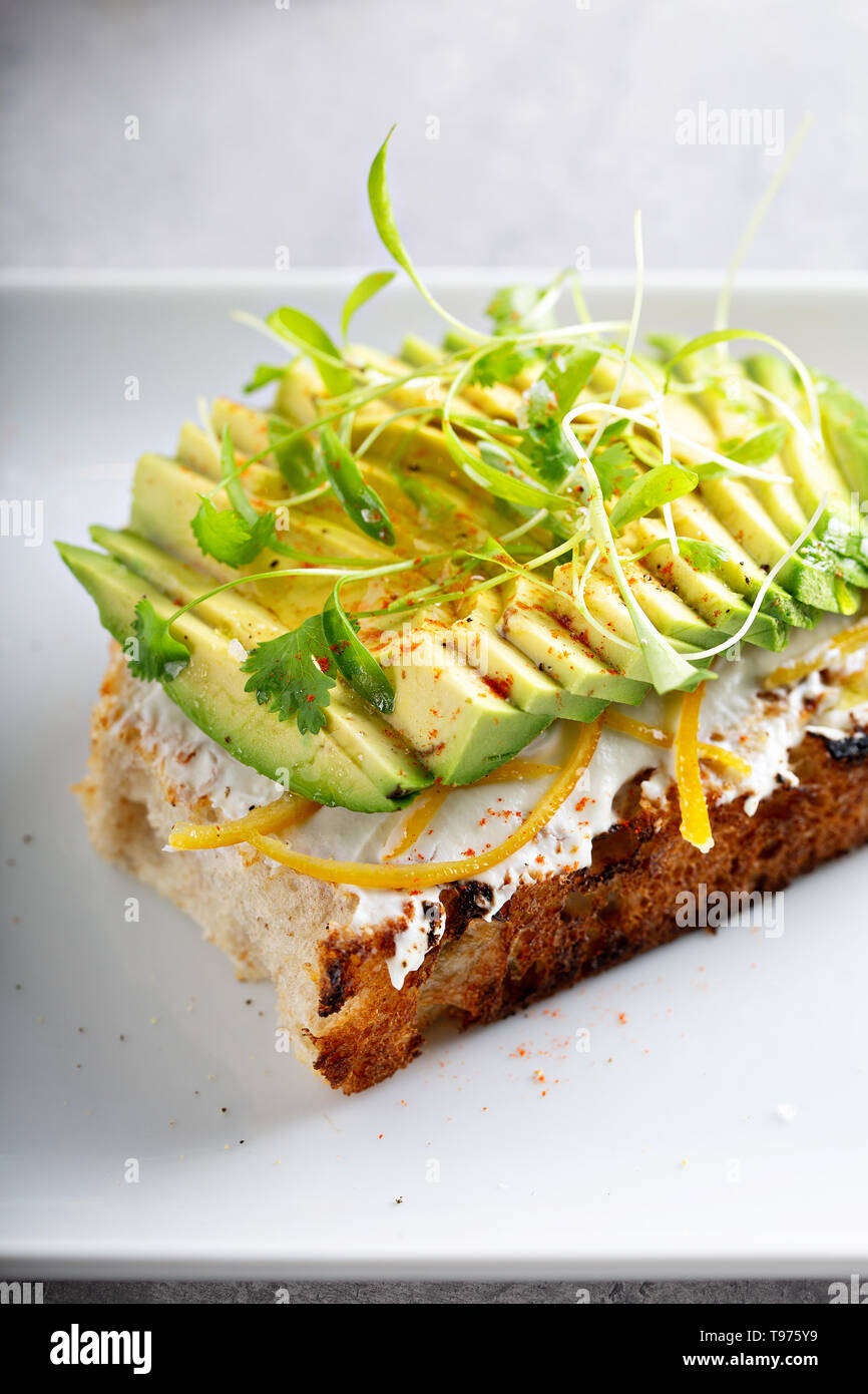 Avocado toast on sour dough bread Stock Photo - Alamy