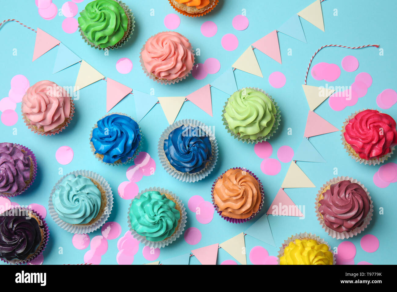 Different cupcakes on color background Stock Photo - Alamy
