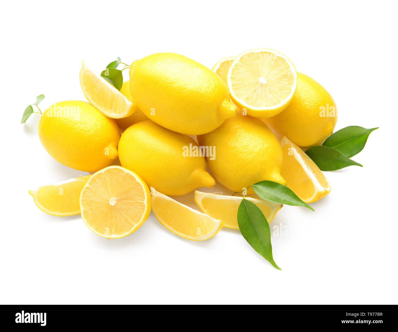 Pile of fresh whole and cut lemons on white background Stock Photo - Alamy