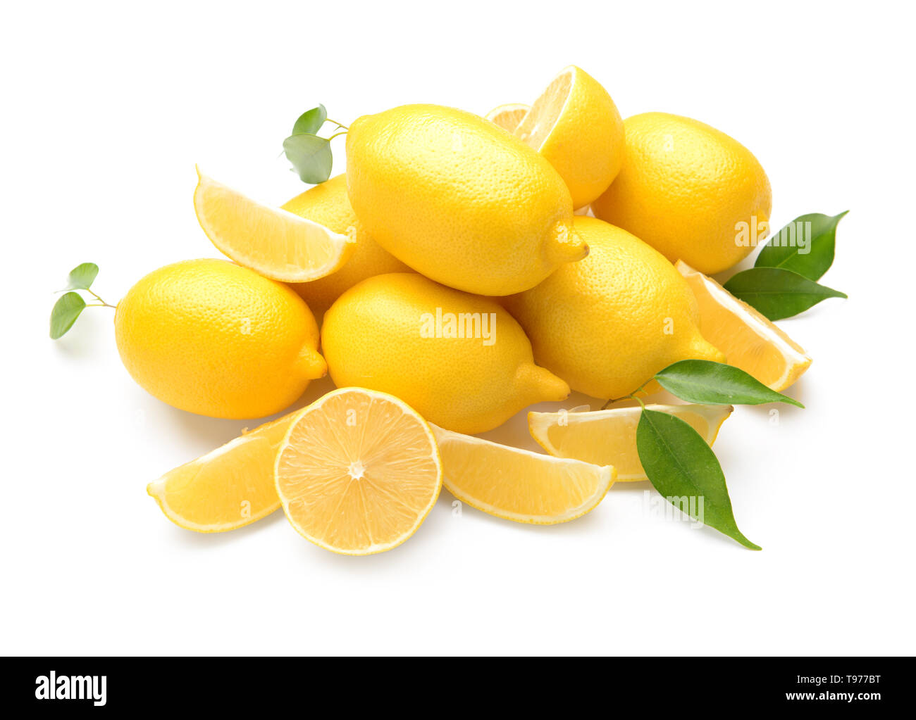 Pile of fresh whole and cut lemons on white background Stock Photo - Alamy