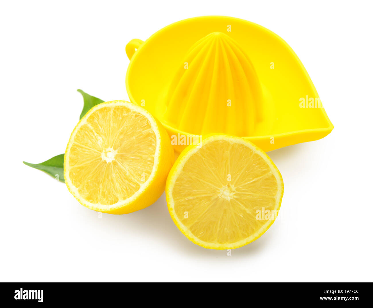 Cut lemon with juicer on white background Stock Photo - Alamy