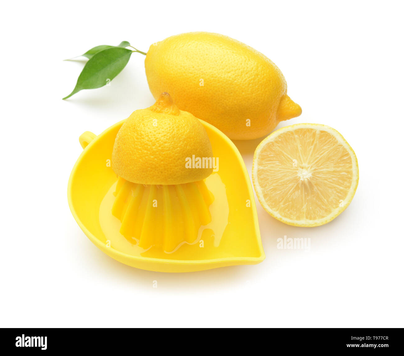 Whole and cut lemon with juicer on white background Stock Photo - Alamy