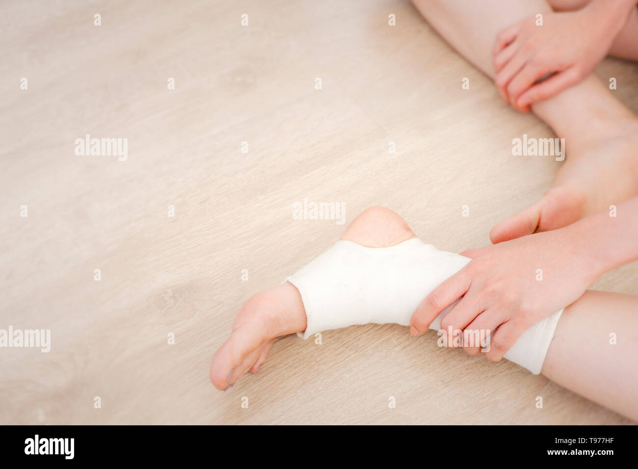 Closeup People of a Foot with White Gauze Elastic Bandage. Hands on ...