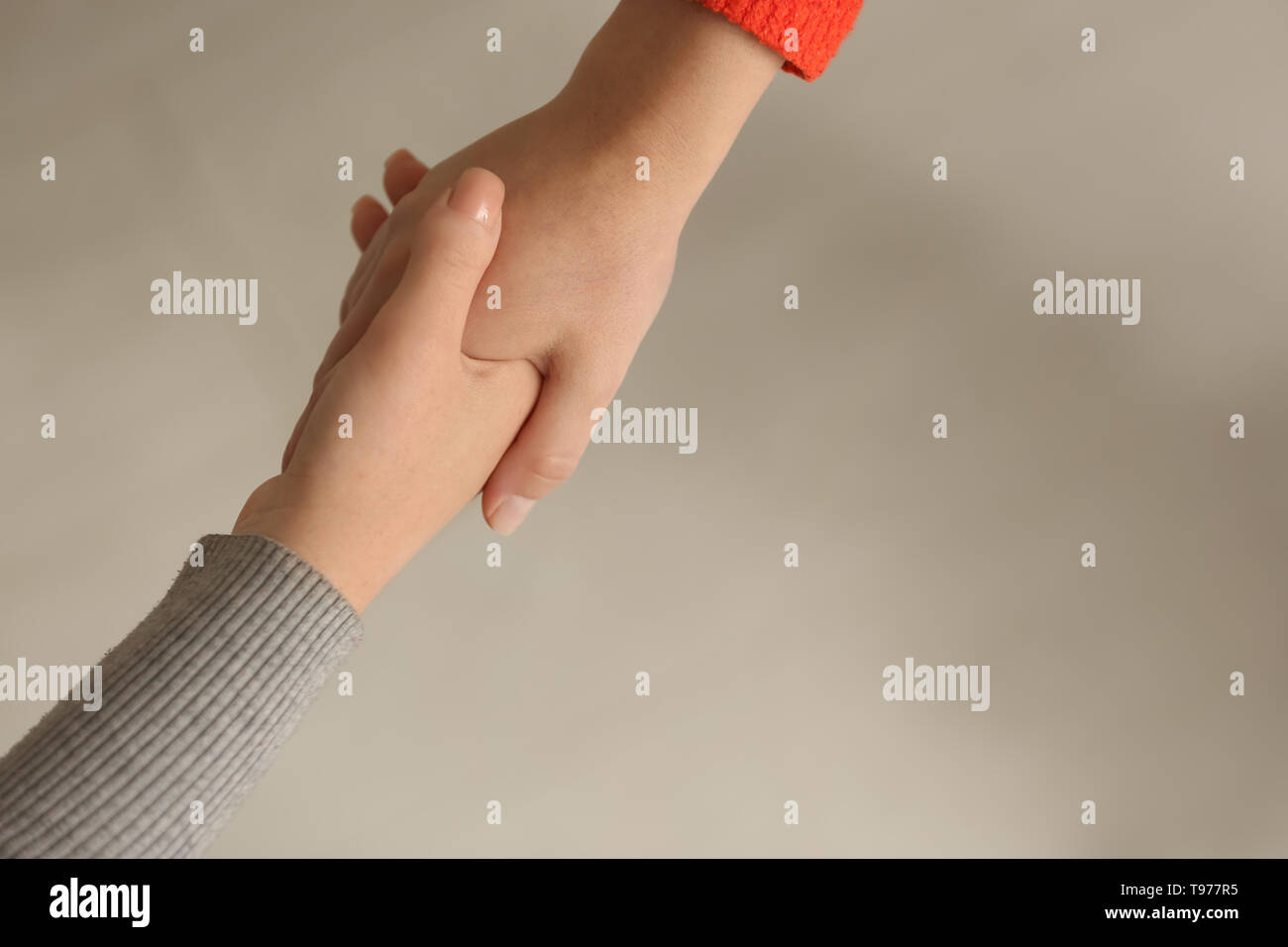 People shaking hands on light background Stock Photo - Alamy
