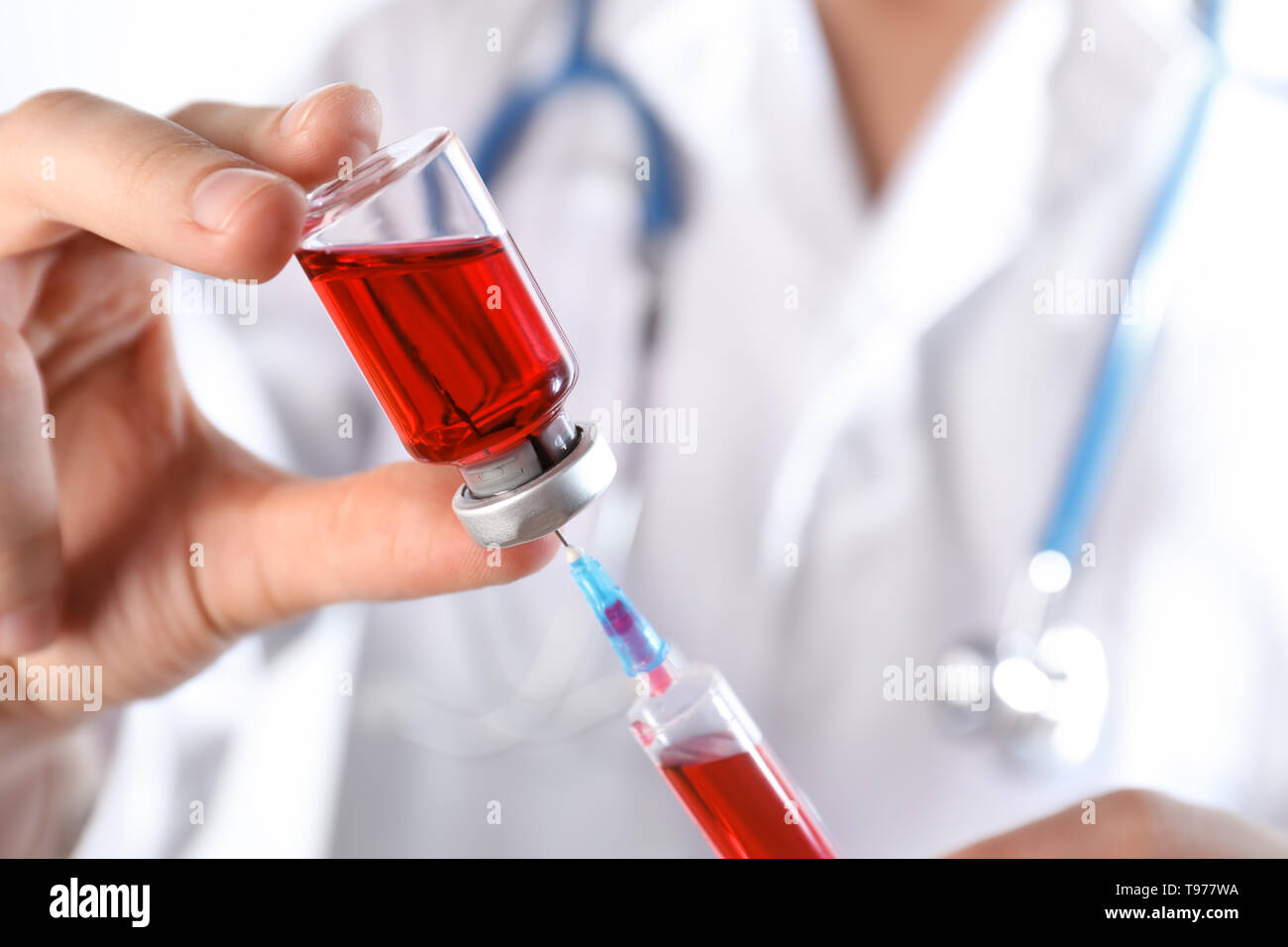Doctor preparing syringe for injection, closeup Stock Photo - Alamy