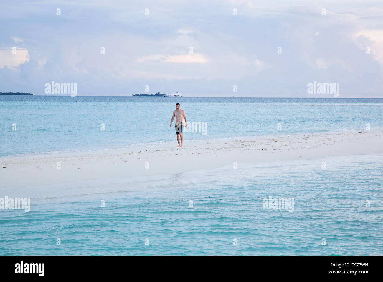 Man walking on Sandbar Stock Photo - Alamy
