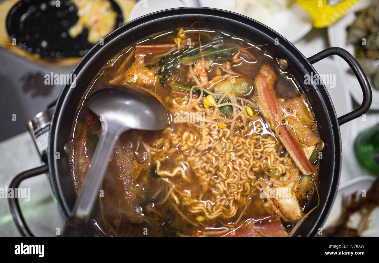 A pot of noodles cooked with seafoods Stock Photo - Alamy
