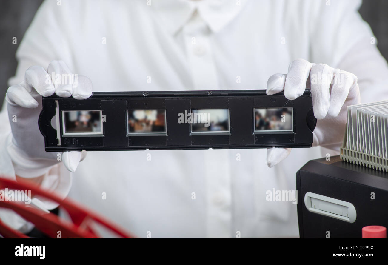 close up hand photographer digitize film slide for saving Stock Photo ...