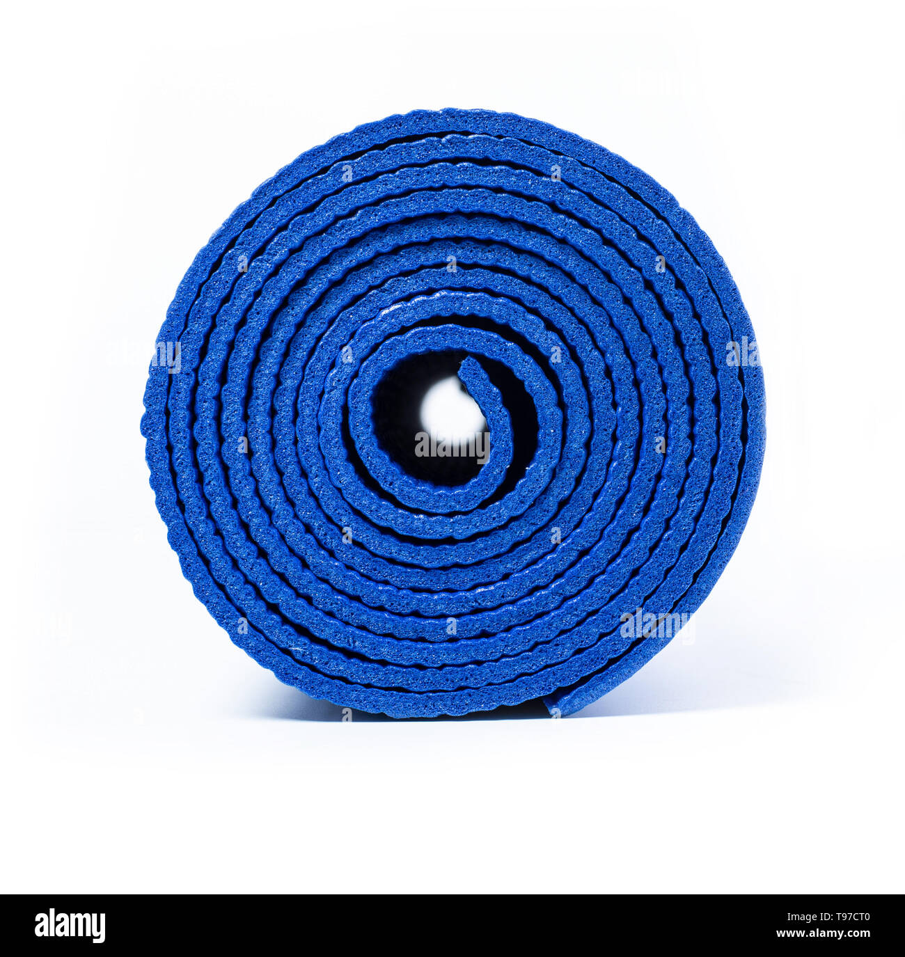 Rolled up blue yoga mat isolated on white Stock Photo - Alamy