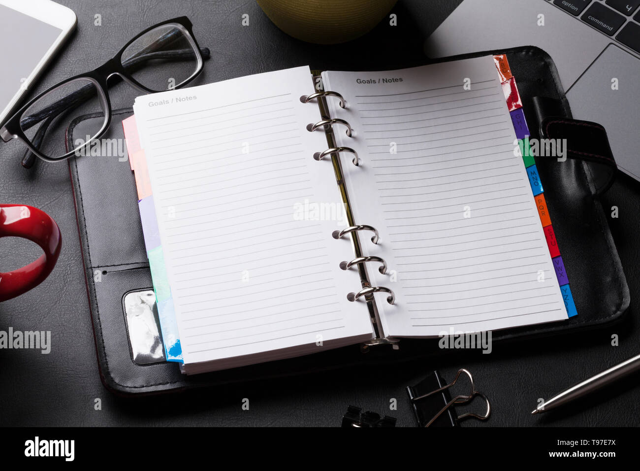 Office workplace table with notepad and laptop. With space for your ...