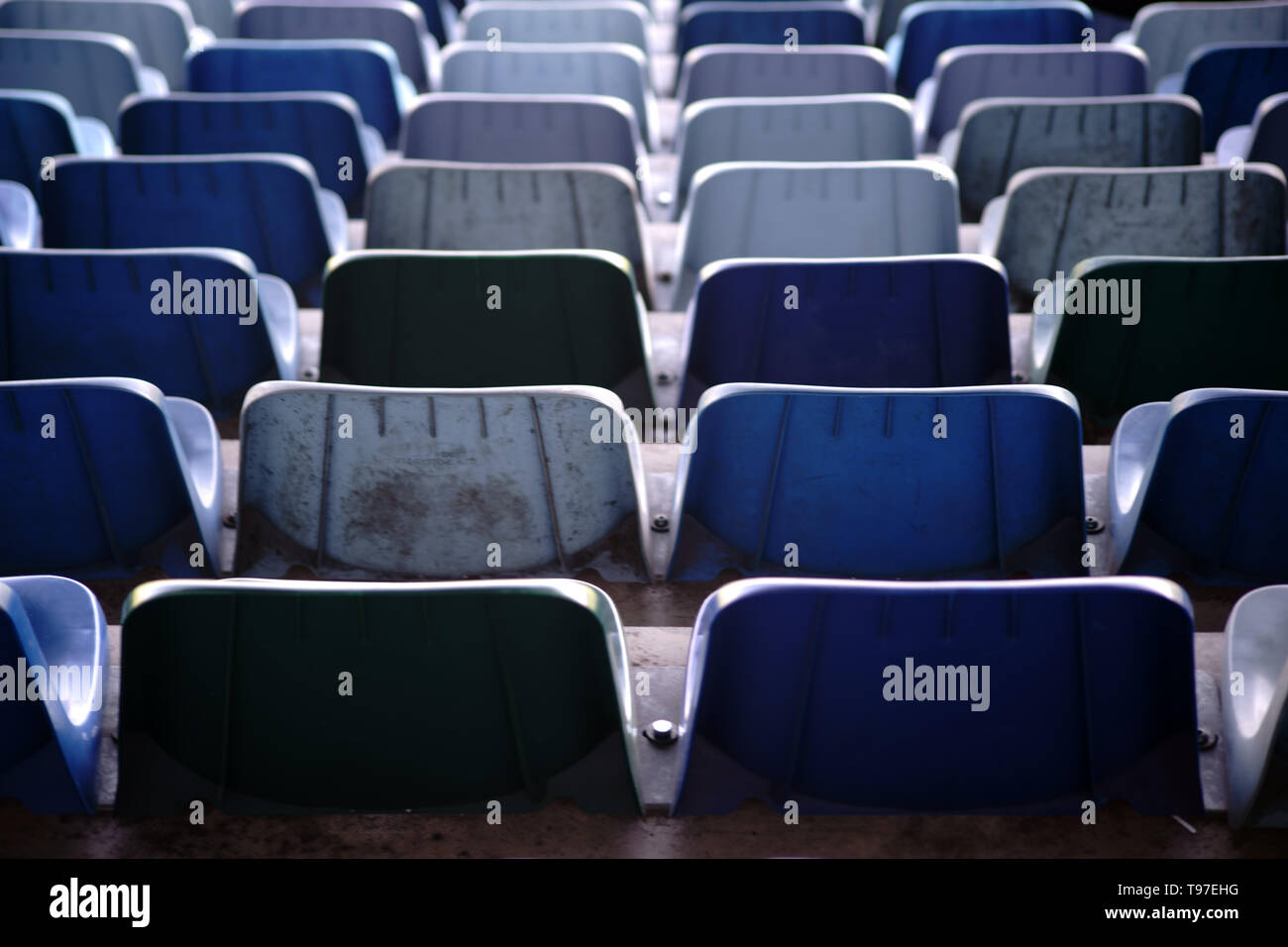 The rear view on the backs and seats of rows of seats in a stadium ...