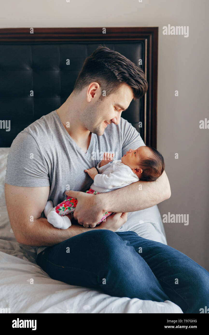 Young Caucasian father dad with his newborn mixed race Asian Chinese ...