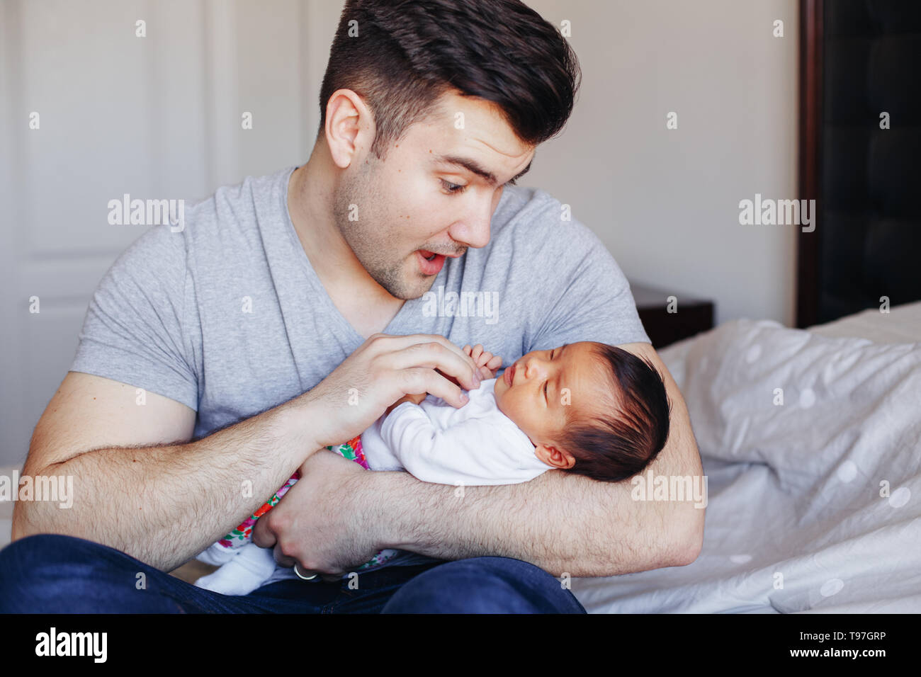 Young Caucasian father dad with his newborn mixed race Asian Chinese ...