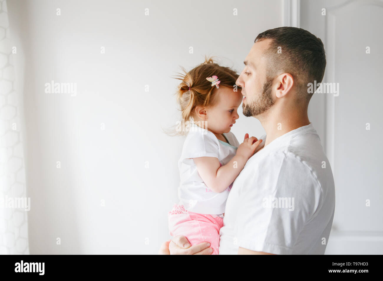 Caucasian father talking speaking with toddler baby girl. Male man ...