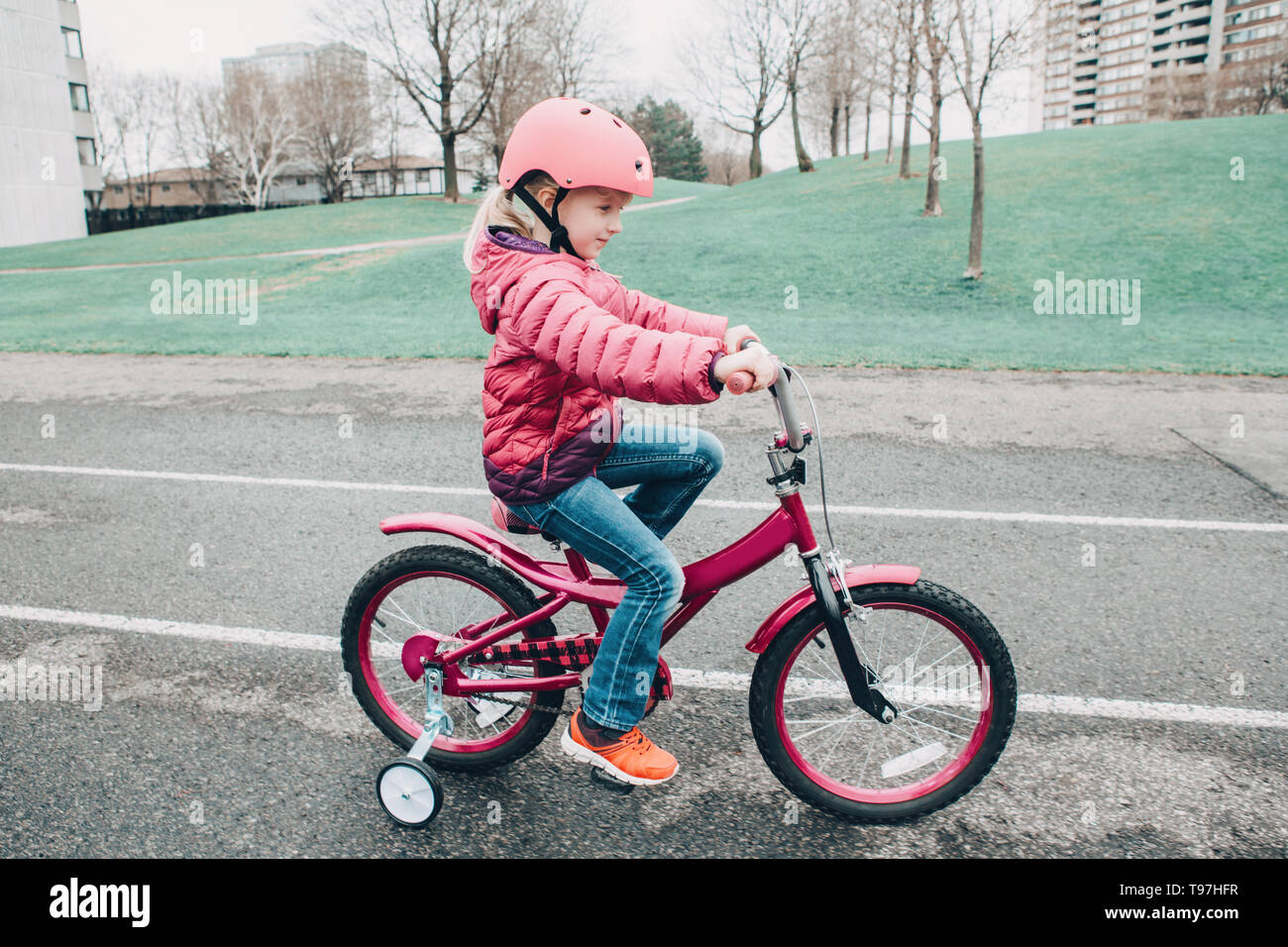 Girl Biking In Pink High Resolution Stock Photography and Images - Alamy