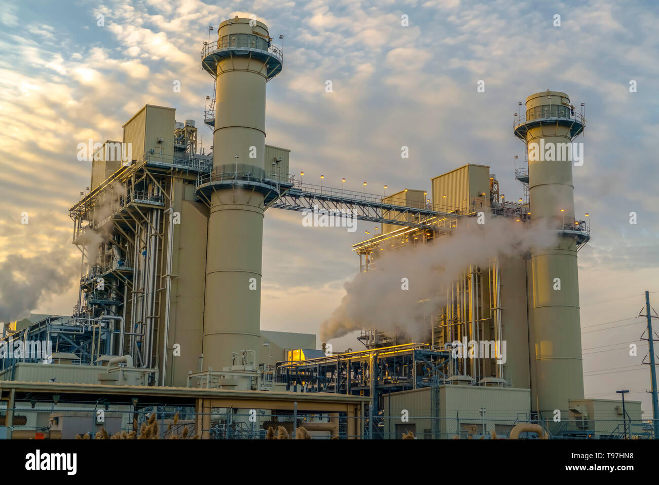 Power Plant in Utah Valley with towers connected by a walkway lined ...