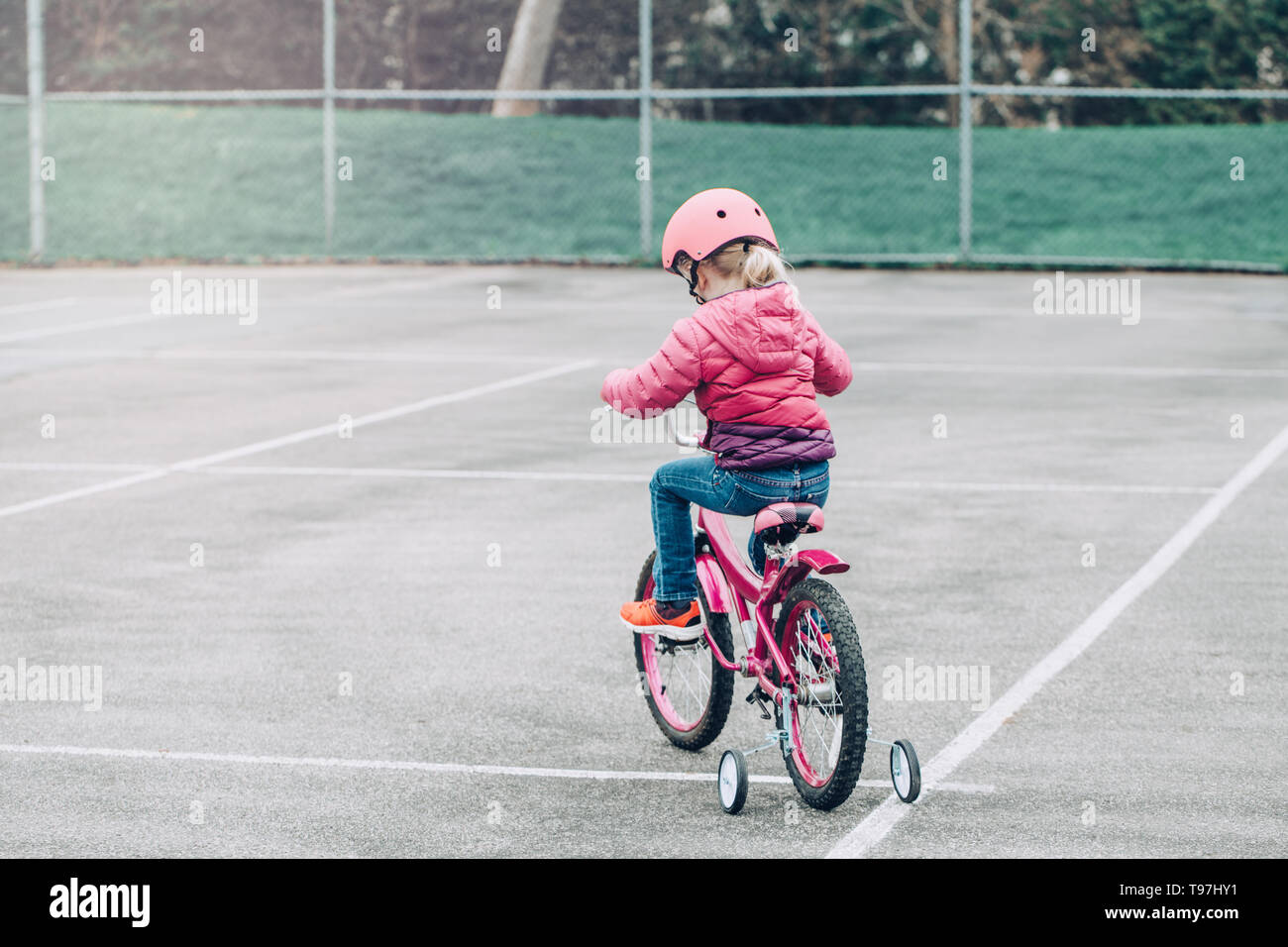 Girl Biking In Pink High Resolution Stock Photography and Images - Alamy