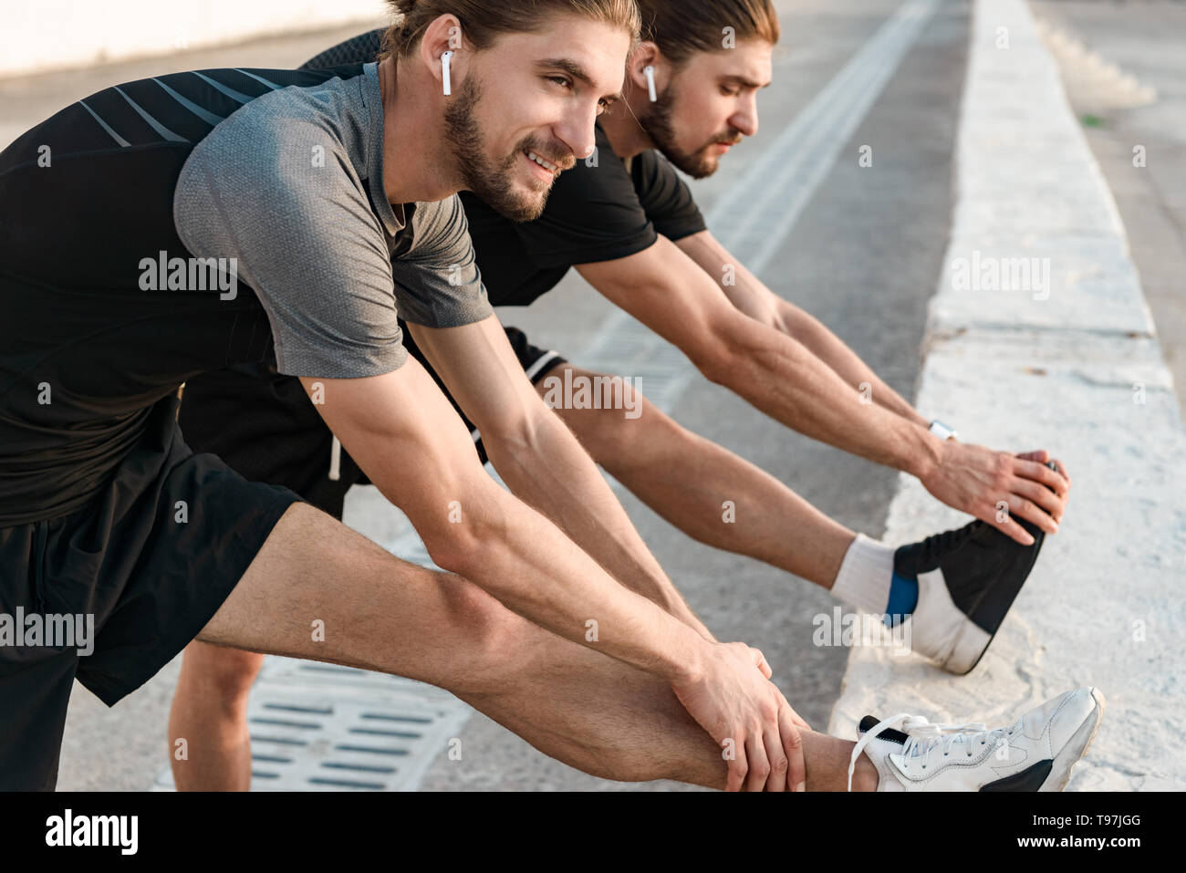 Two handsome brothers stand hi-res stock photography and images - Alamy