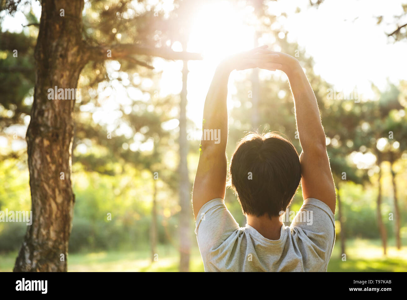 Back view of man doing stretching hi-res stock photography and images ...