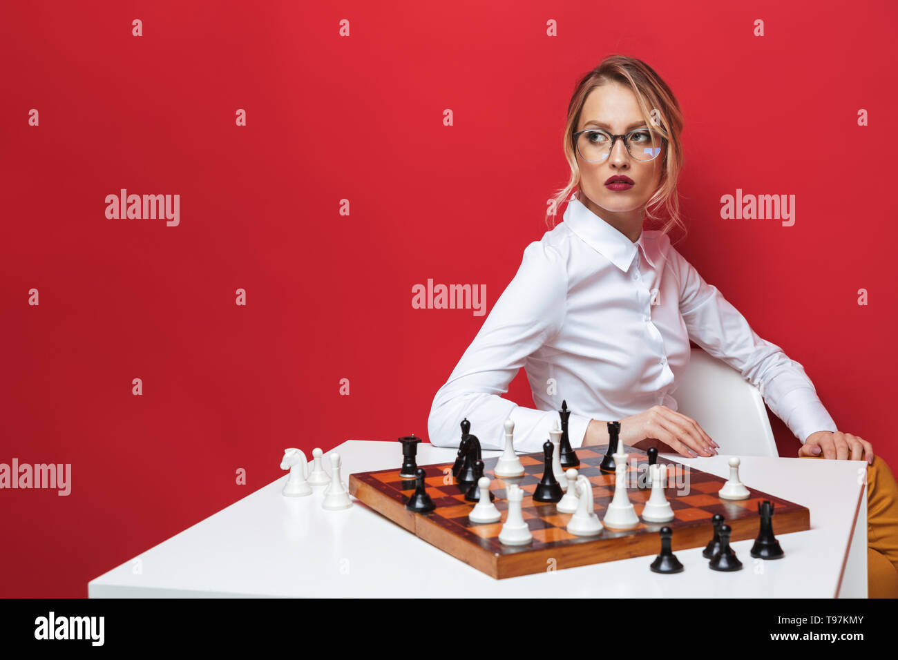 Beautiful woman playing chess hi-res stock photography and images - Alamy