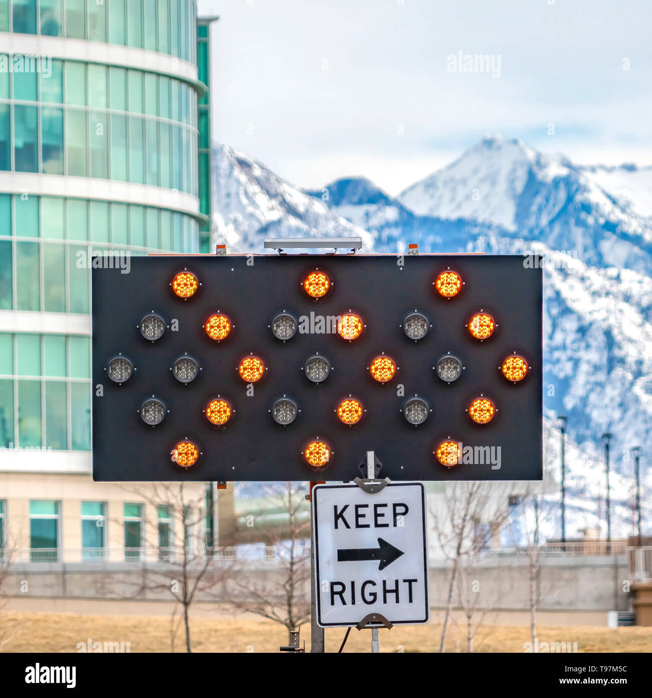 Clear Square Keep Right sign underneath an arrow board surrounded by ...