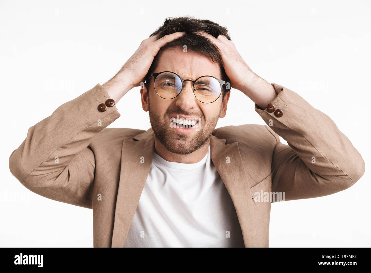 Image of tense man 30s with stubble wearing jacket and eyeglasses ...