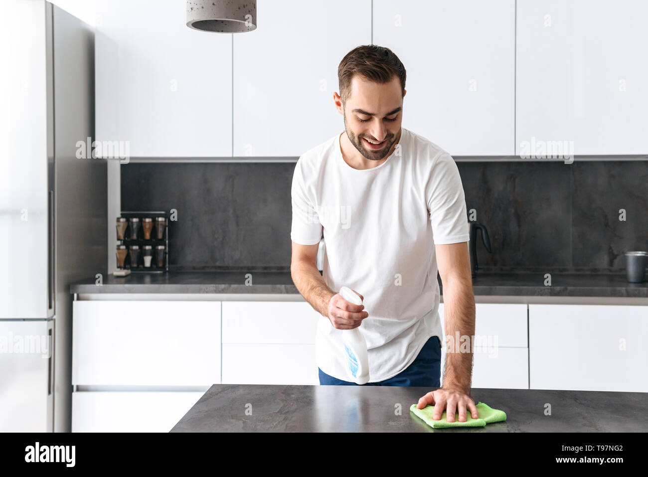 Man cleaning kitchen hi-res stock photography and images - Alamy