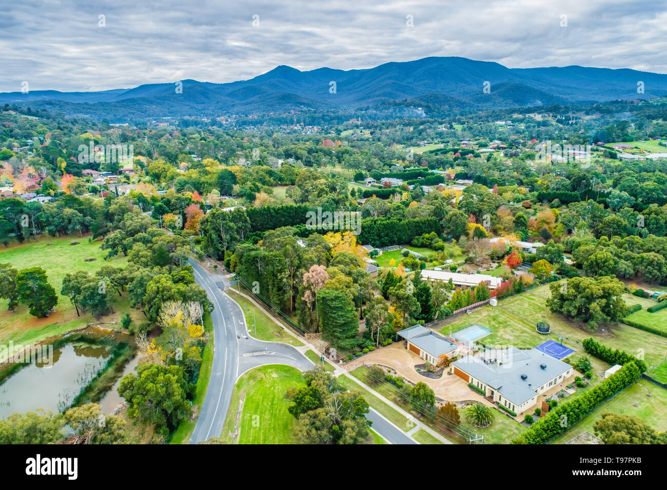Aerial landscape of rural houses among trees in fall. Healesville ...