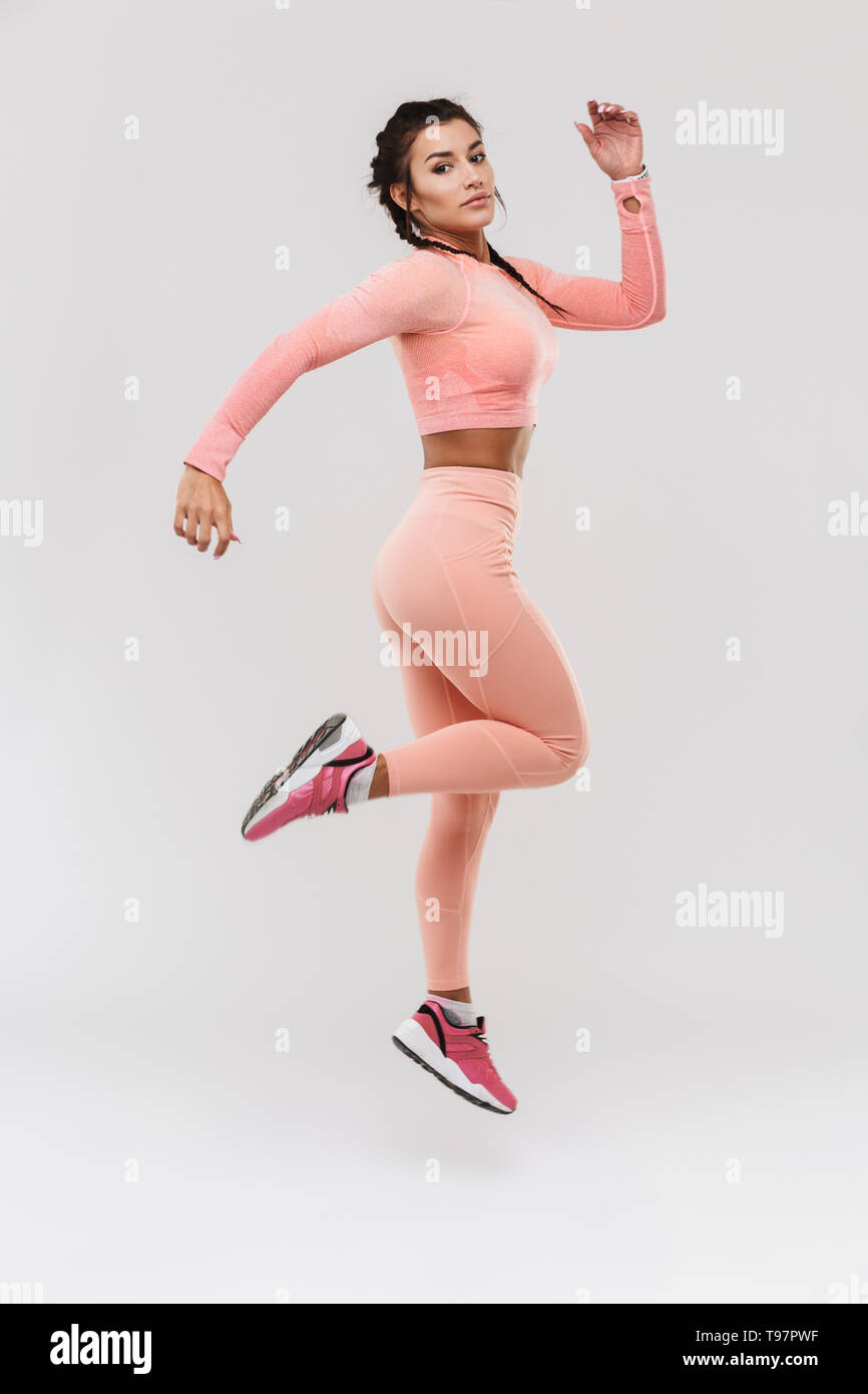 Picture of a beautiful young amazing strong sports fitness woman posing ...