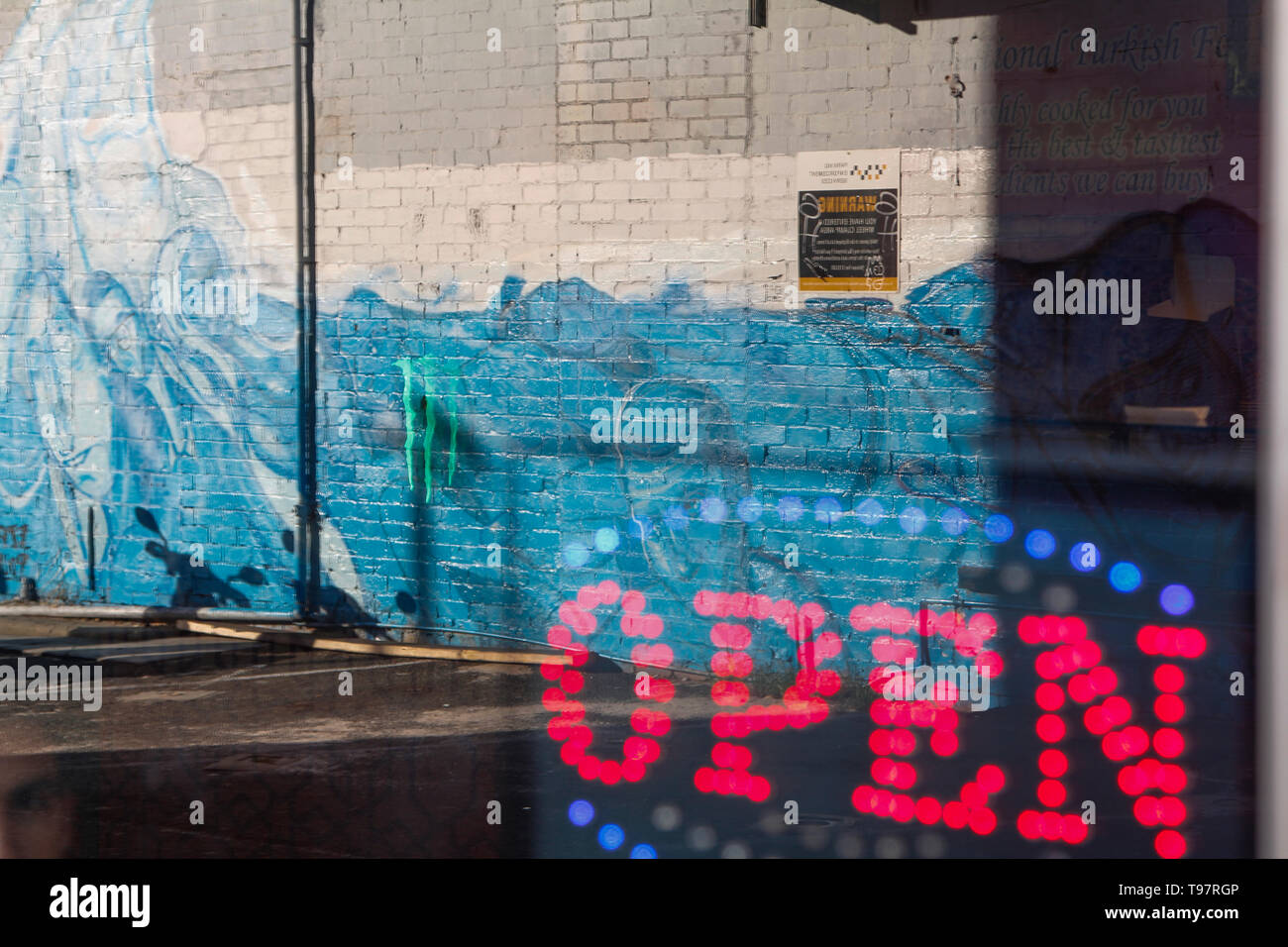 Open LED Neon Sign reflection on window glass, Perth, Australia Stock ...