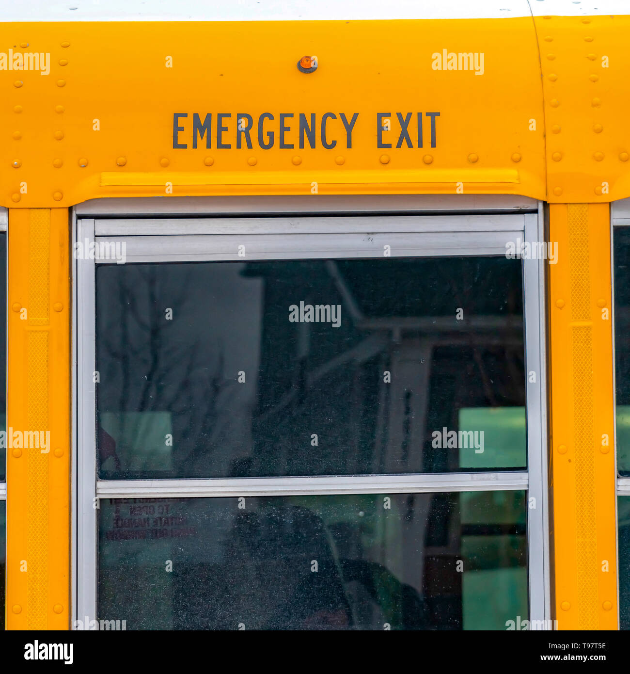 Square Exterior of a yellow school bus with a close up view of its ...
