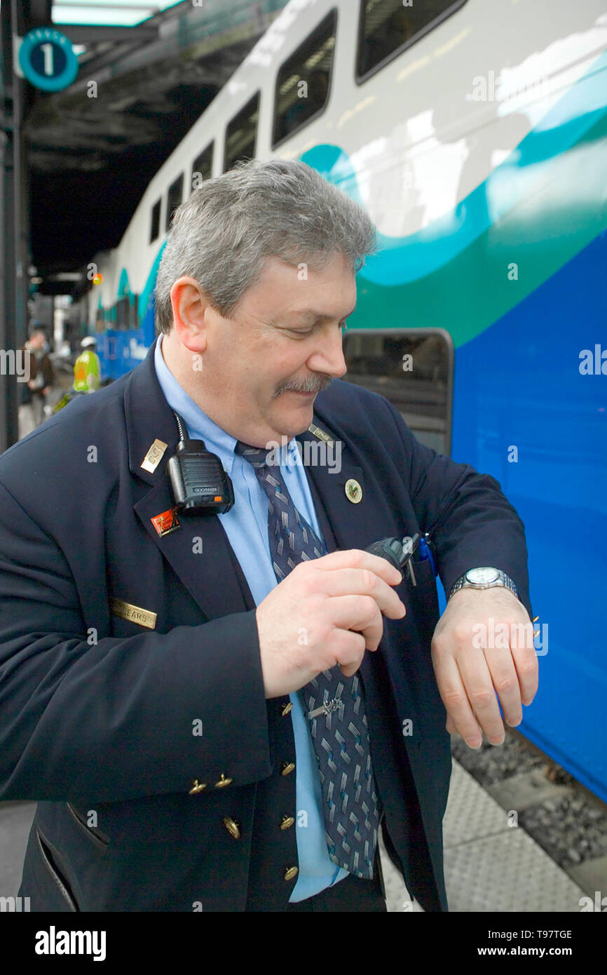 Railroad conductor with watch hi-res stock photography and images - Alamy