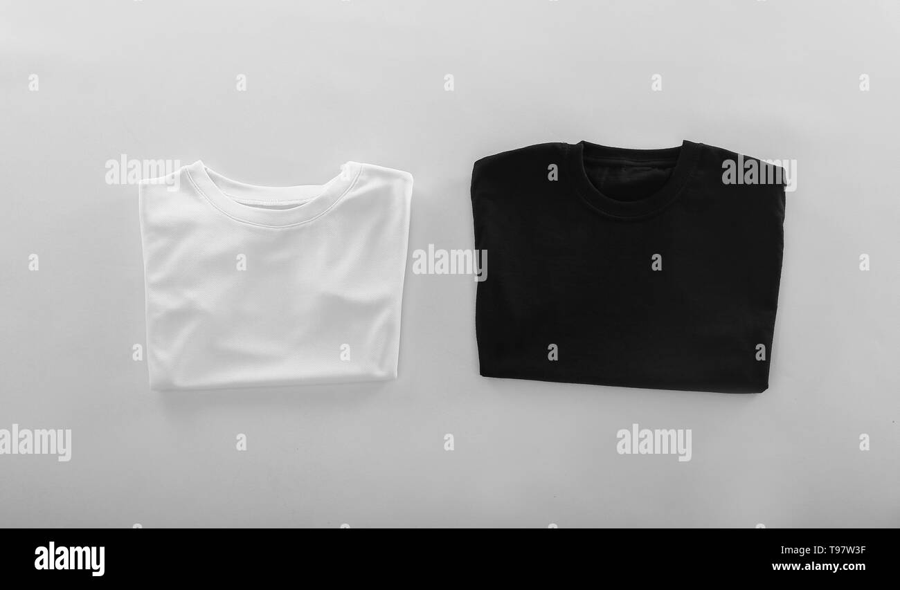 Blank t-shirts on white background Stock Photo - Alamy