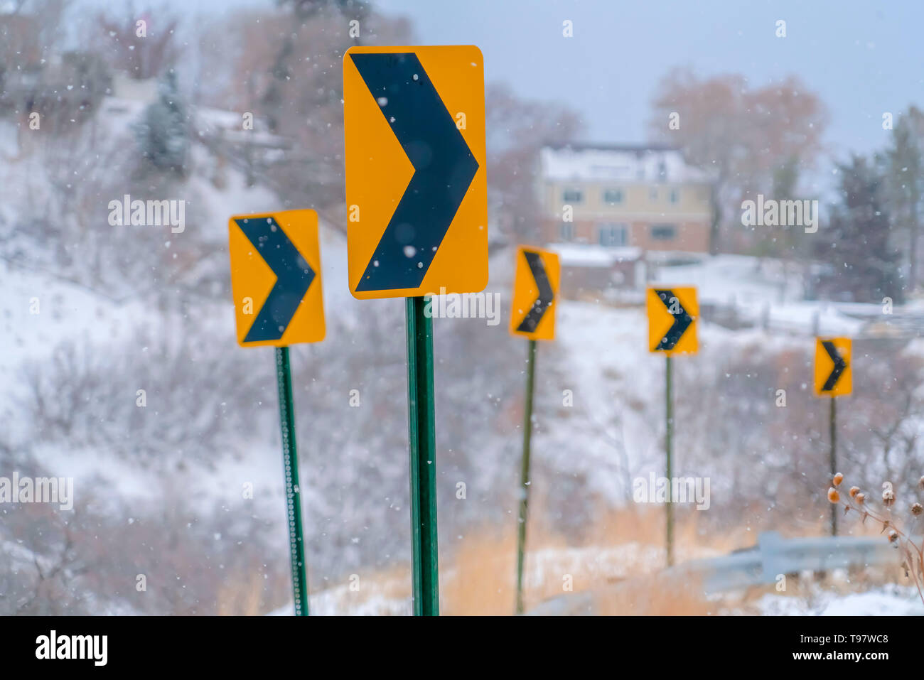 Directional road signs against a snowy landscape Stock Photo - Alamy